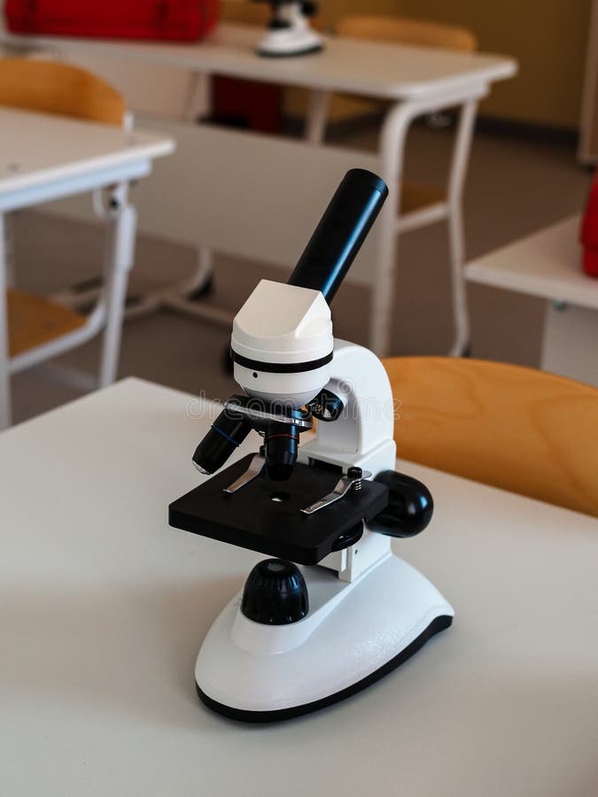 A Microscope for a Student at a Desk in a Classroom Stock Image - Image ...