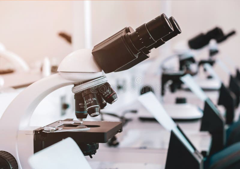 Microscope on Table in the Laboratory. Line of Microscopes on Stock ...