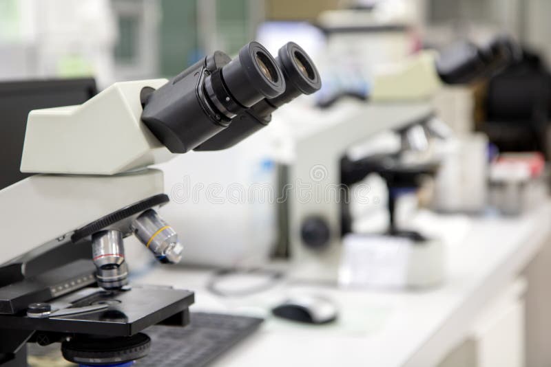 A Microscope on a Table in the Laboratory Stock Photo - Image of ...