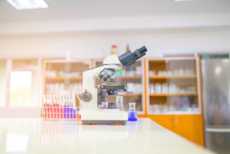 Microscope on the Table in Laboratory Room with Laboratory Equipment ...