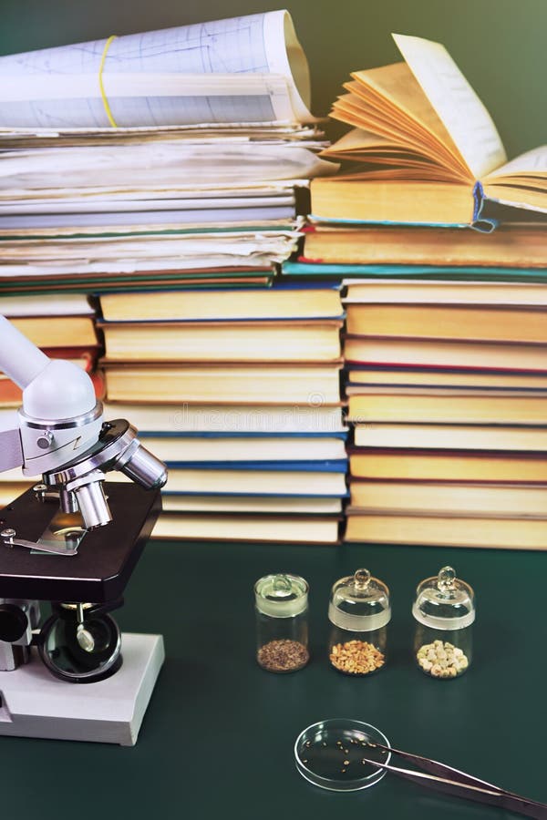 Microscope and Test Specimens on the Table with Books Stock Photo ...