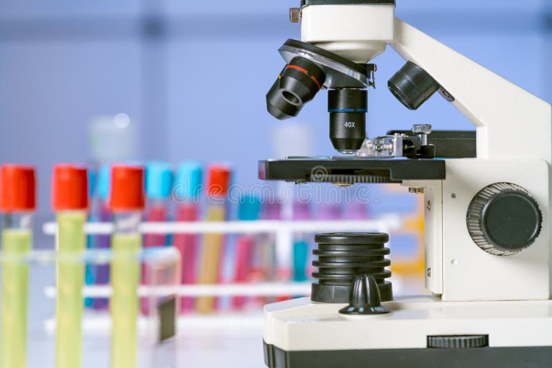 Microscope and Test Tubes on Laboratoy Table Editorial Stock Image ...