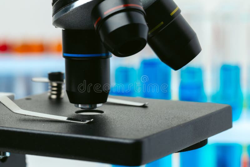 Microscope and Test Tubes on Table in Laboratory, Close Up Stock Image ...