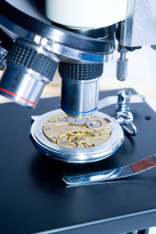 Microscope and a watch stock image. Image of magnification - 13925835