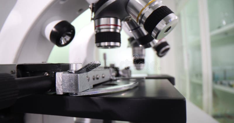 Electronic Microscopes on Table in Laboratory Next To Chemicals Stock ...