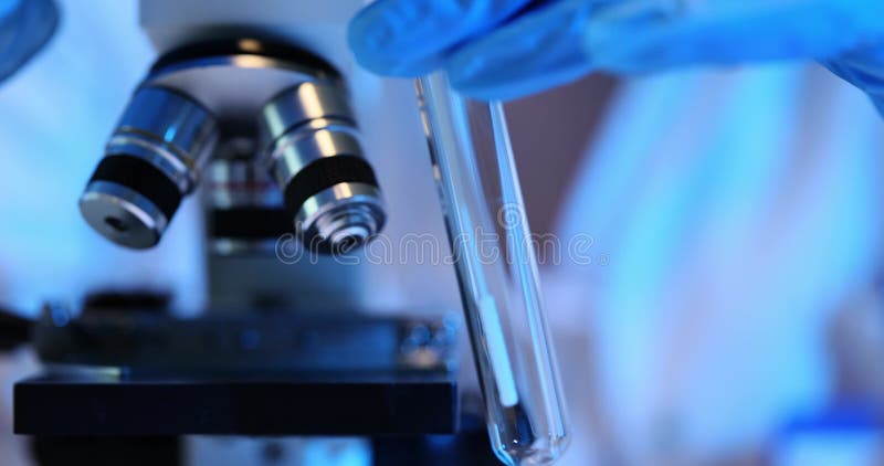 Microscopic Analysis of a Sample in a Test Tube in a Laboratory Stock ...