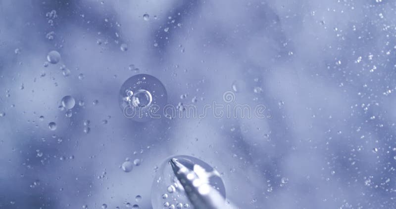 Microscopic Close-up of a Droplet of Liquid Chemical Solution in ...