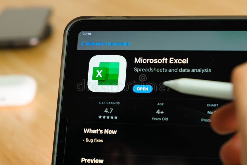 Microsoft Excel Logo Shown by Apple Pencil on the IPad Pro Tablet Screen. Man Using Application ...