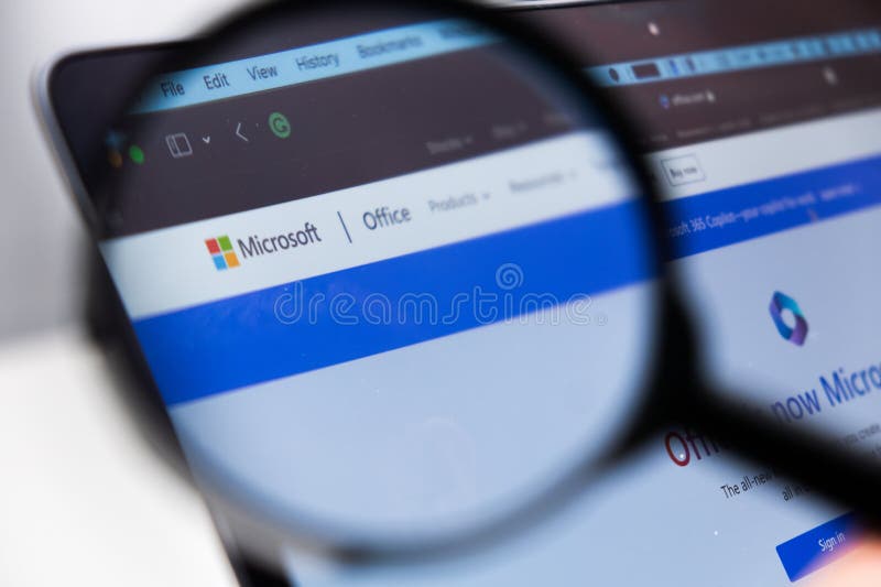 Microsoft Office Logo on the Screen of Laptop through Magnifying Glass ...