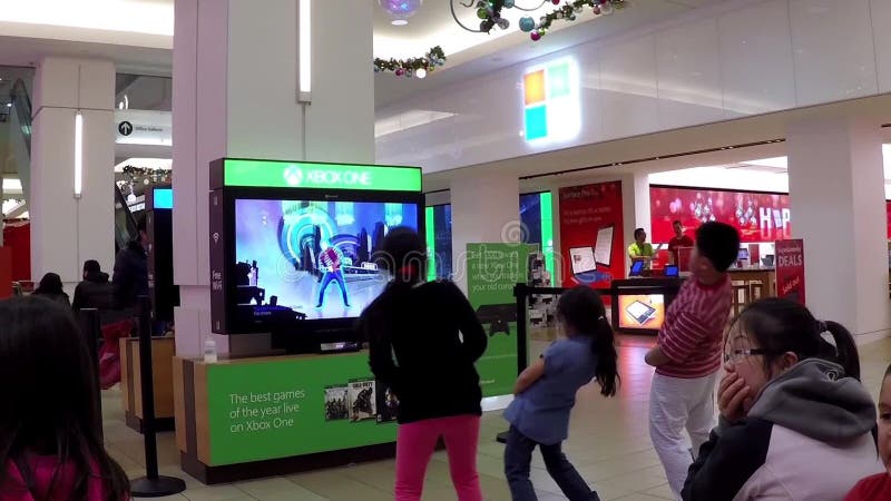 Microsoft Staff Demonstrates with Children Dance Game at the Mall Stock ...