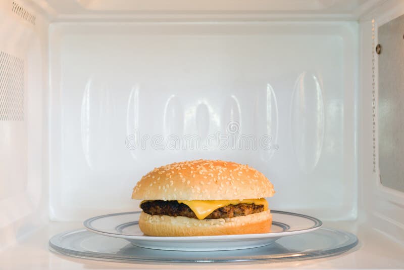 Microwave Cheeseburger stock image. Image of cooked - 144803649