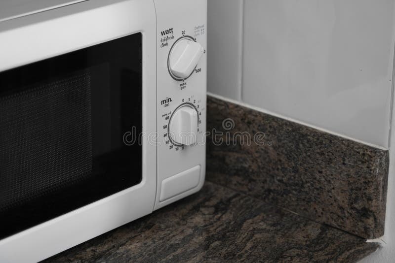 Microwave in a Kitchen for Cooking or Heating a Dish. Stock Image ...