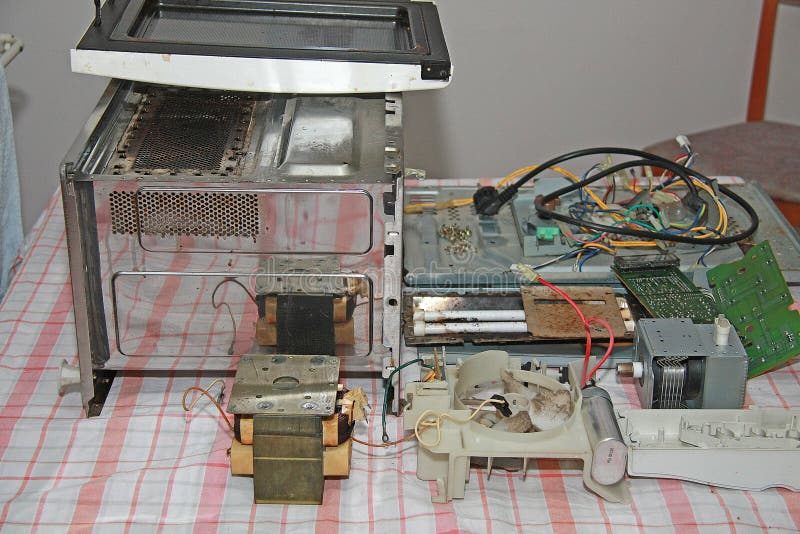 Microwave Oven Disassembled on a Kitchen Table Stock Photo - Image of ...