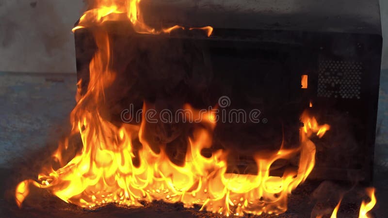 Microwave Oven on Fire. the Concept of Fire in the Kitchen. Stock ...