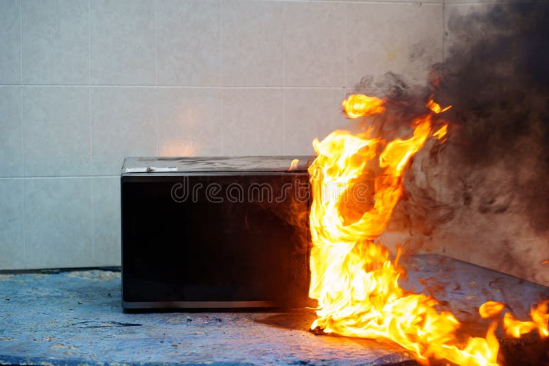 Microwave Oven on Fire. the Concept of Fire in the Kitchen. Stock Image ...
