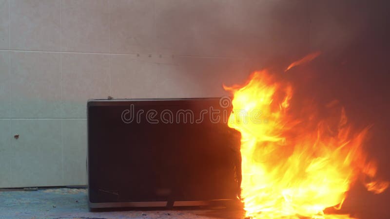 Microwave Oven on Fire. the Concept of Fire in the Kitchen. Stock ...