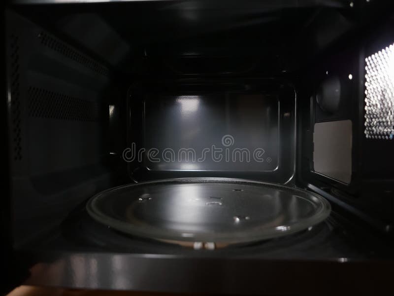 Microwave oven interior stock image. Image of space - 393598349