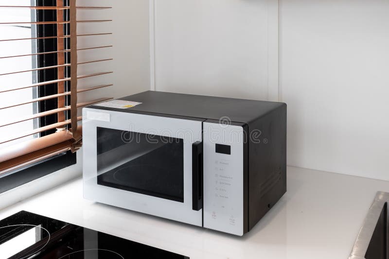 Microwave in a White Kitchen of Minimal House Stock Image - Image of ...