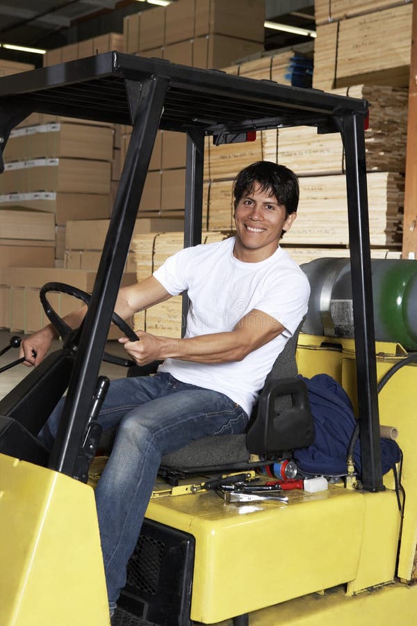 Mid Adult Man Driving Forklift Loader in Warehouse Stock Image - Image ...