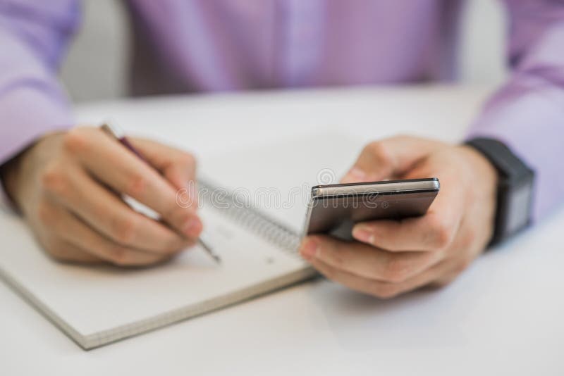 Mid-adult Professional Businessman Taking Notes into Organiser. Stock ...