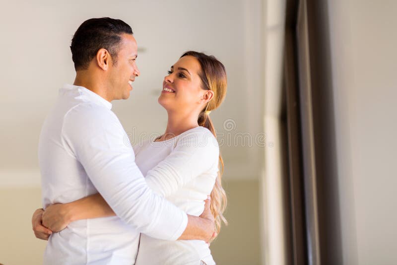 Mid age couple embracing stock photo. Image of beautiful - 54454406
