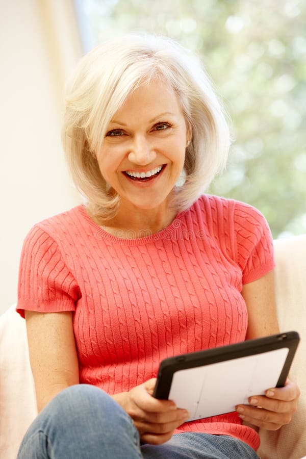 Mid Age Woman Using Tablet at Home Stock Image - Image of adult ...