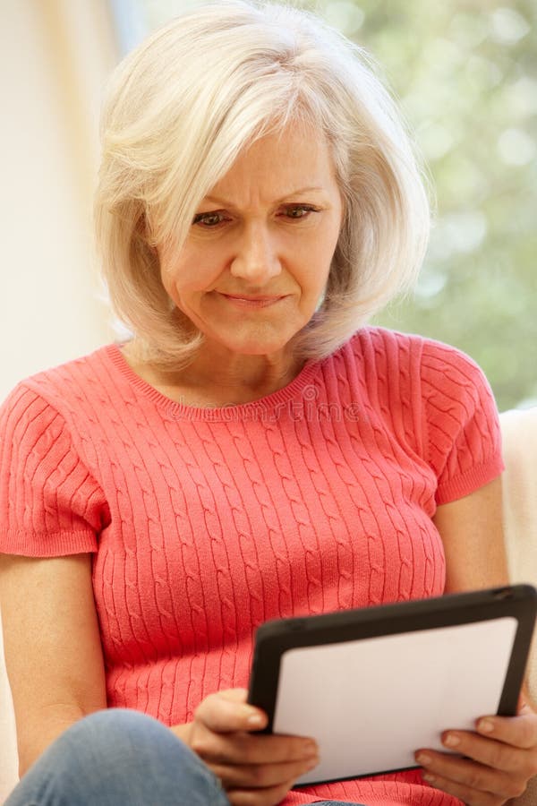Mid Age Woman Using Tablet at Home Stock Photo - Image of internet ...