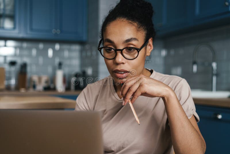 Mid Aged African Woman Using Laptop Computer Stock Photo - Image of ...