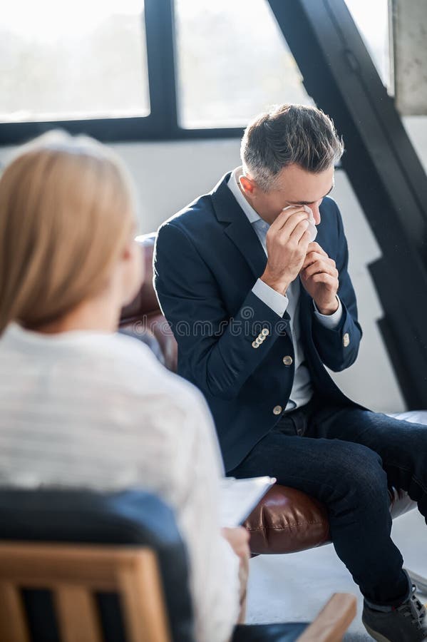 Mid Aged Man Looking Upset and Telling about His Problems To a ...