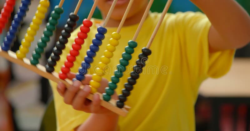 Kid Using Abacus To Calculate Simple Addition Equations Stock Video ...