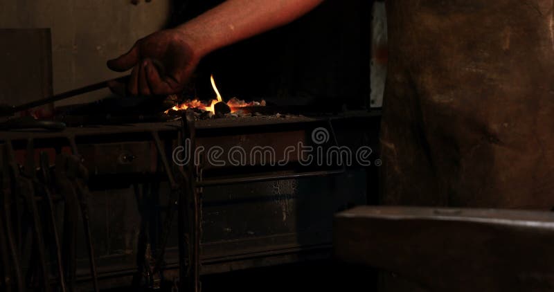 Blacksmith Heating Metal Rod in Fire 4k Stock Footage - Video of ...