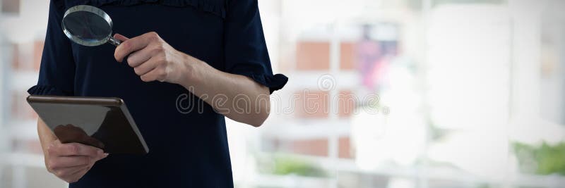 Composite Image of Mid-section of Business Woman Using Tablet and ...