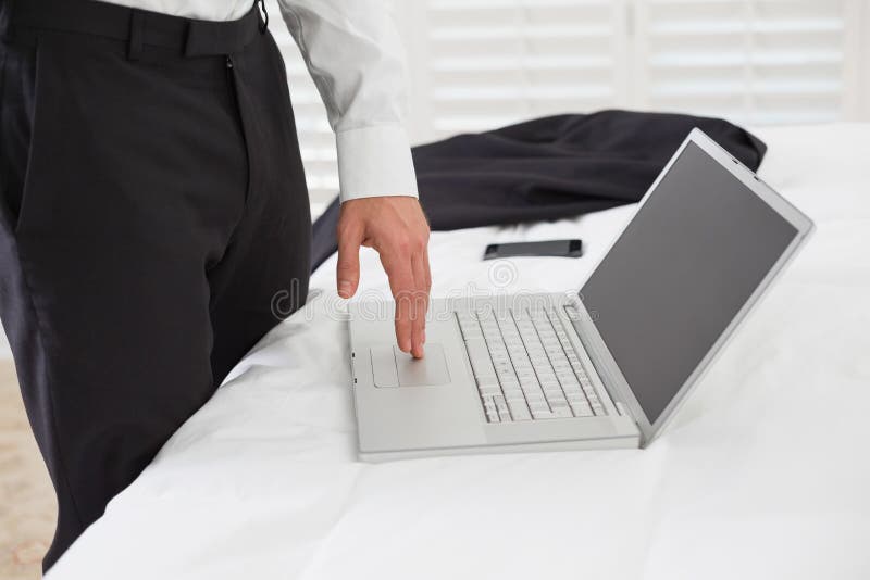 Mid Section of Businessman Using Laptop at Hotel Room Stock Image ...