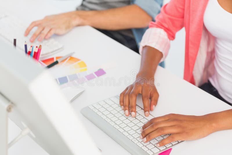 Mid Section of a Casual Couple Working on Computers Stock Image - Image ...