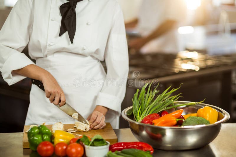 Mid Section Of Chef Cutting Vegetables - Stock Image - Everypixel