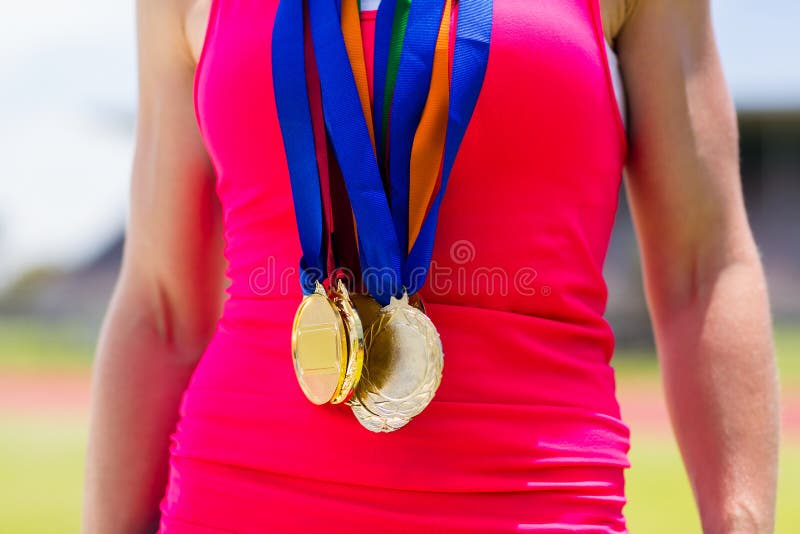 Mid Section of Female Athlete with Gold Medals Stock Photo - Image of ...