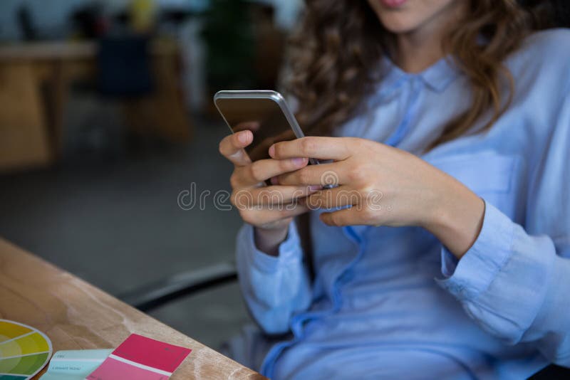 Mid Section of Female Graphic Designer Using Mobile Phone Stock Photo ...