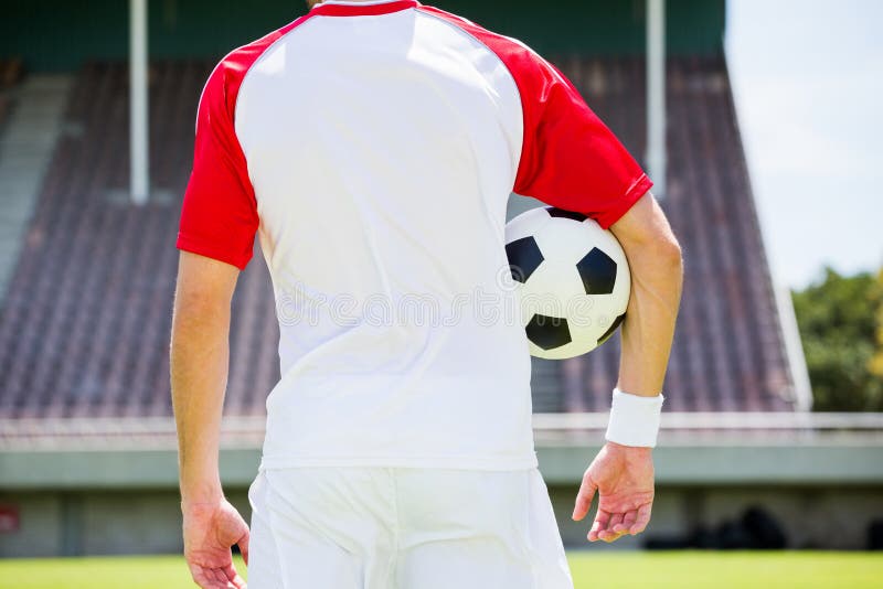 Mid Section of Football Player Standing with a Ball Stock Image - Image ...