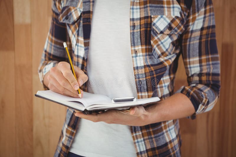 Mid Section of Hipster Writing with Pencil on Book Stock Photo - Image ...