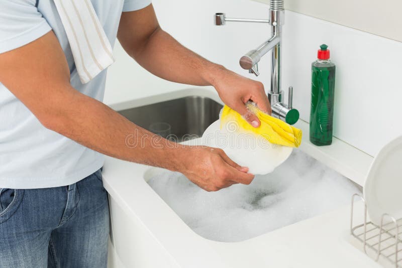 Mid Section of a Man Doing the Dishes at Kitchen Sink Stock Photo ...