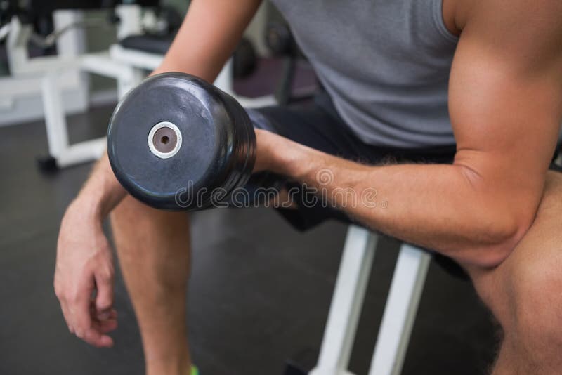 Mid Section of Man Exercising with Dumbbell in Gym Stock Photo - Image ...