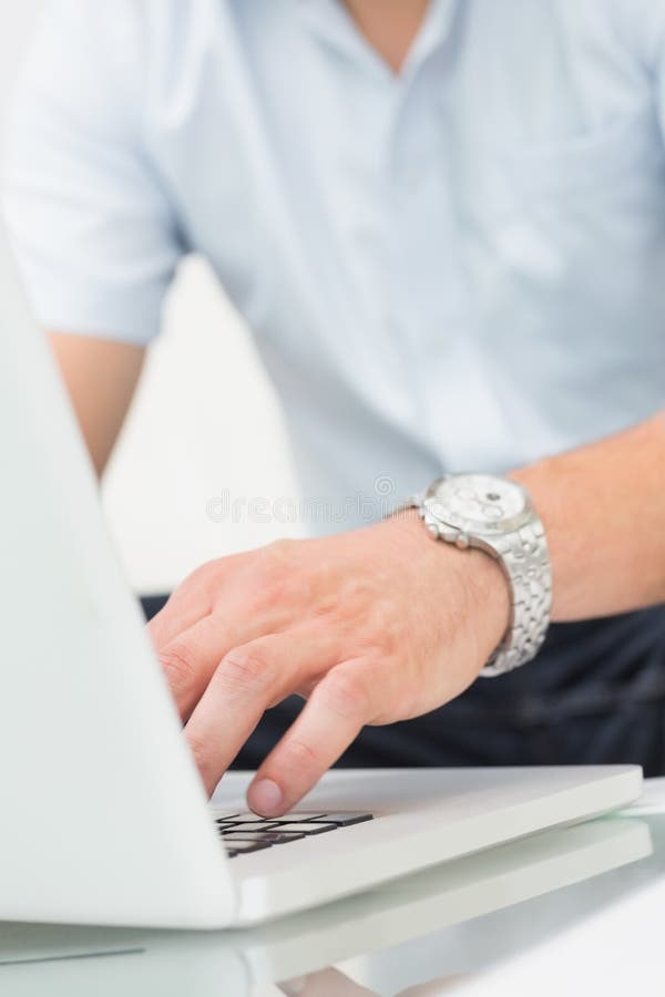 Mid Section of a Man Using Laptop on Coffee Table Stock Image - Image ...