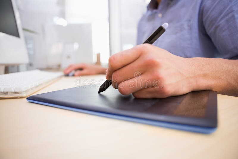 Mid Section of Man Working on Computer and Digitizer Stock Photo ...