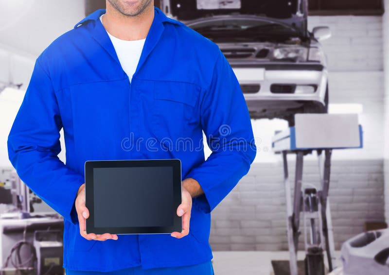 Mid Section of Mechanic Holding a Digital Tablet Stock Image - Image of ...