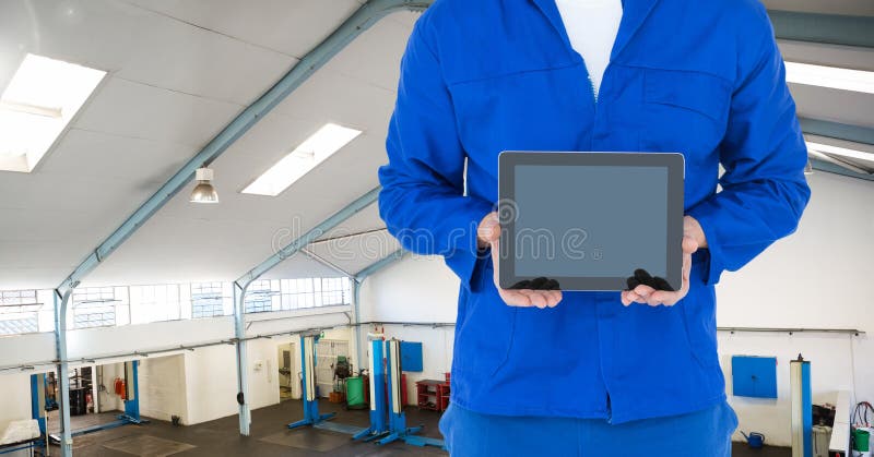 Mid Section of Mechanic Holding Digital Tablet Stock Photo - Image of ...