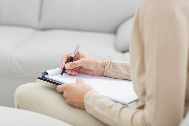 Mid Section of a Psychologist Writing Notes Stock Image - Image of sofa ...