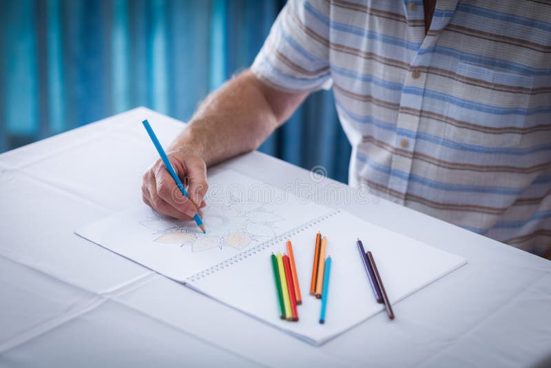 Mid Section of Senior Man Drawing in Drawing Book Stock Photo - Image ...