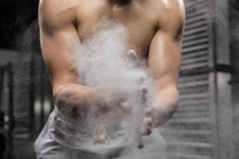 Mid Section of Shirtless Man Clapping Hands with Talc Stock Image ...