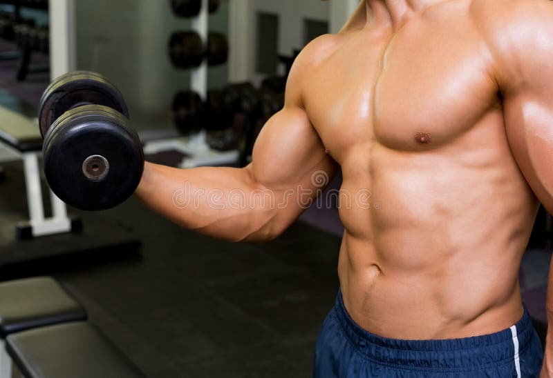 Mid Section of Shirtless Muscular Man Exercising with Dumbbell Stock ...