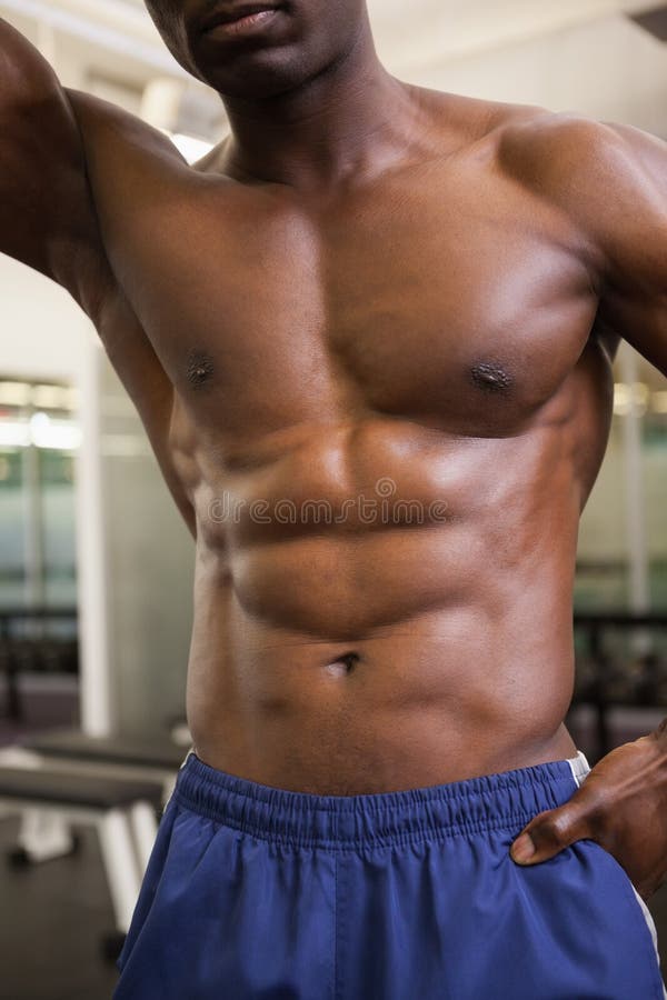 Mid Section of a Shirtless Muscular Man in Gym Stock Image - Image of ...